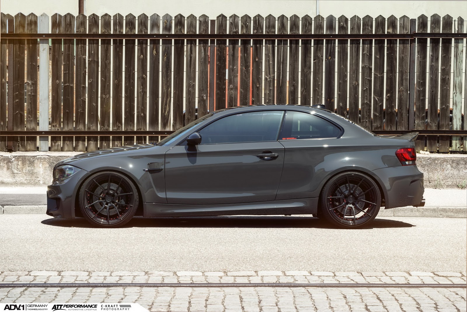 This BMW 1M Looks Simply Ferocious On Matte Black Rims | Carscoops