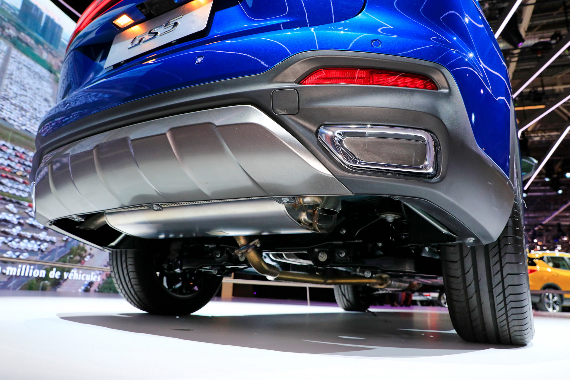 The Fake Exhaust Holes Of The Paris Auto Show Floor | Carscoops