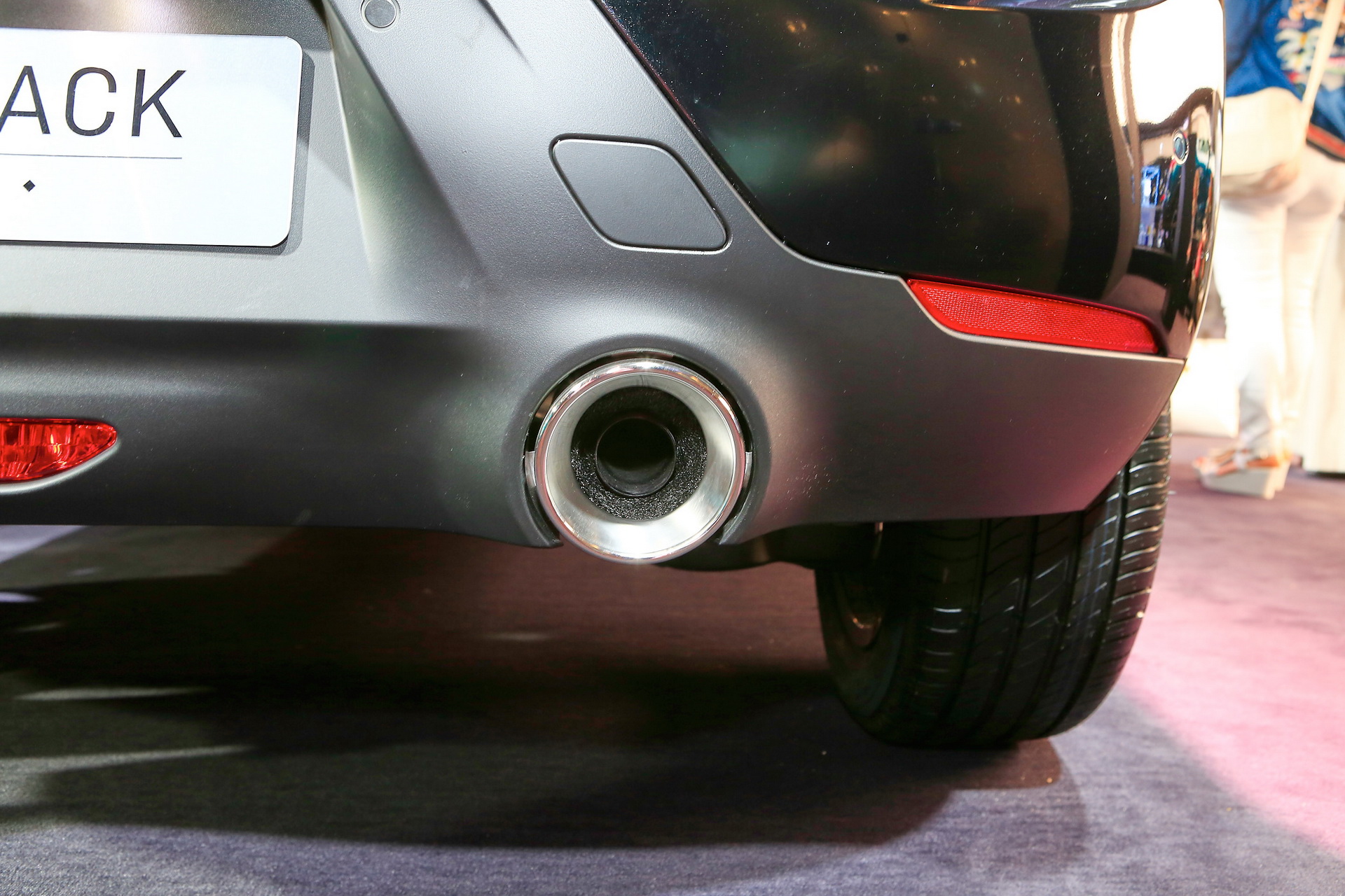 The Fake Exhaust Holes Of The Paris Auto Show Floor | Carscoops
