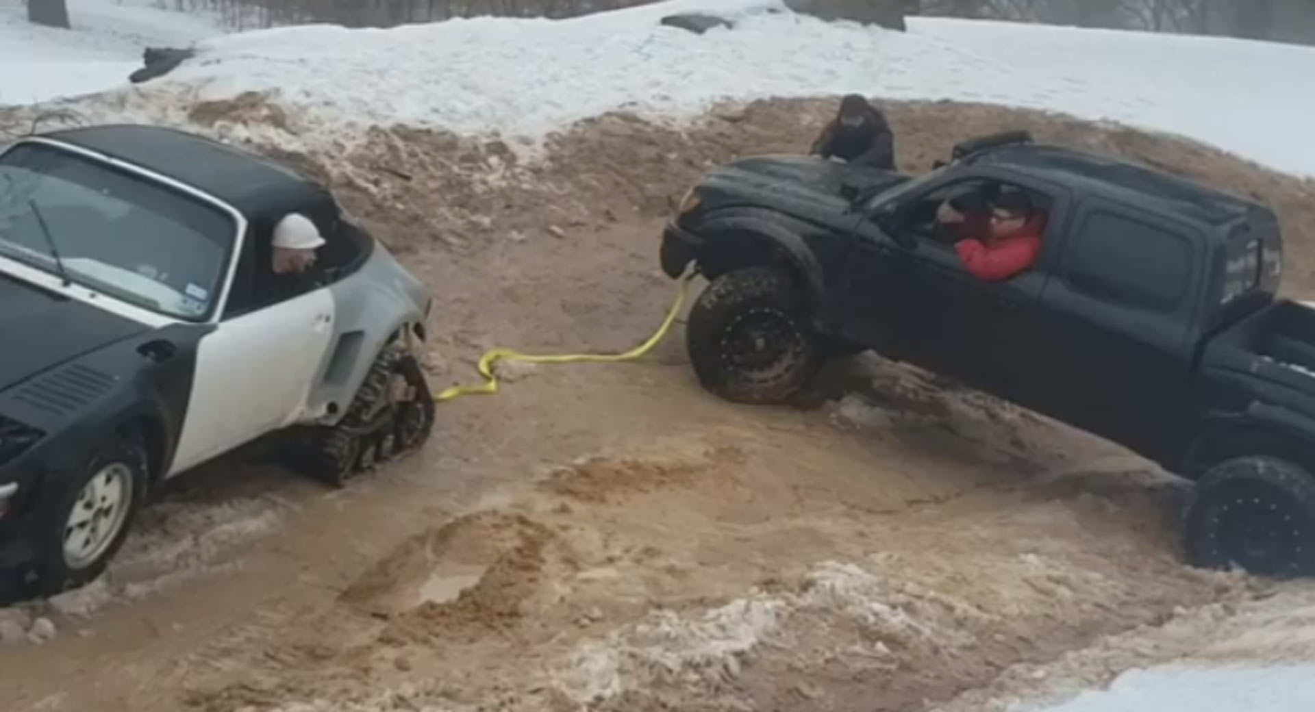 Porsche 911 On Tracks Rescues A Toyota Pickup Stuck In The Mud | Carscoops