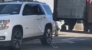 Semi Truck Smashes Parked Chevy Tahoe While Trying To Maneuver | Carscoops
