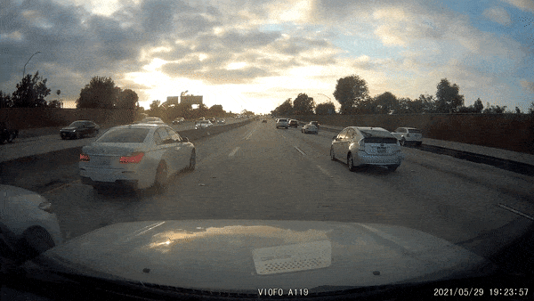 Two Drivers Almost Crash As They Squeeze Between Traffic | Carscoops
