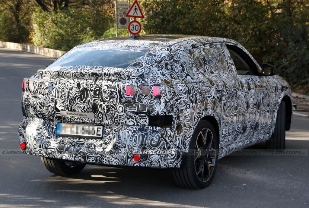 2024 BMW iX2 EV Spied With A Covered Grille And Sloping Roofline ...