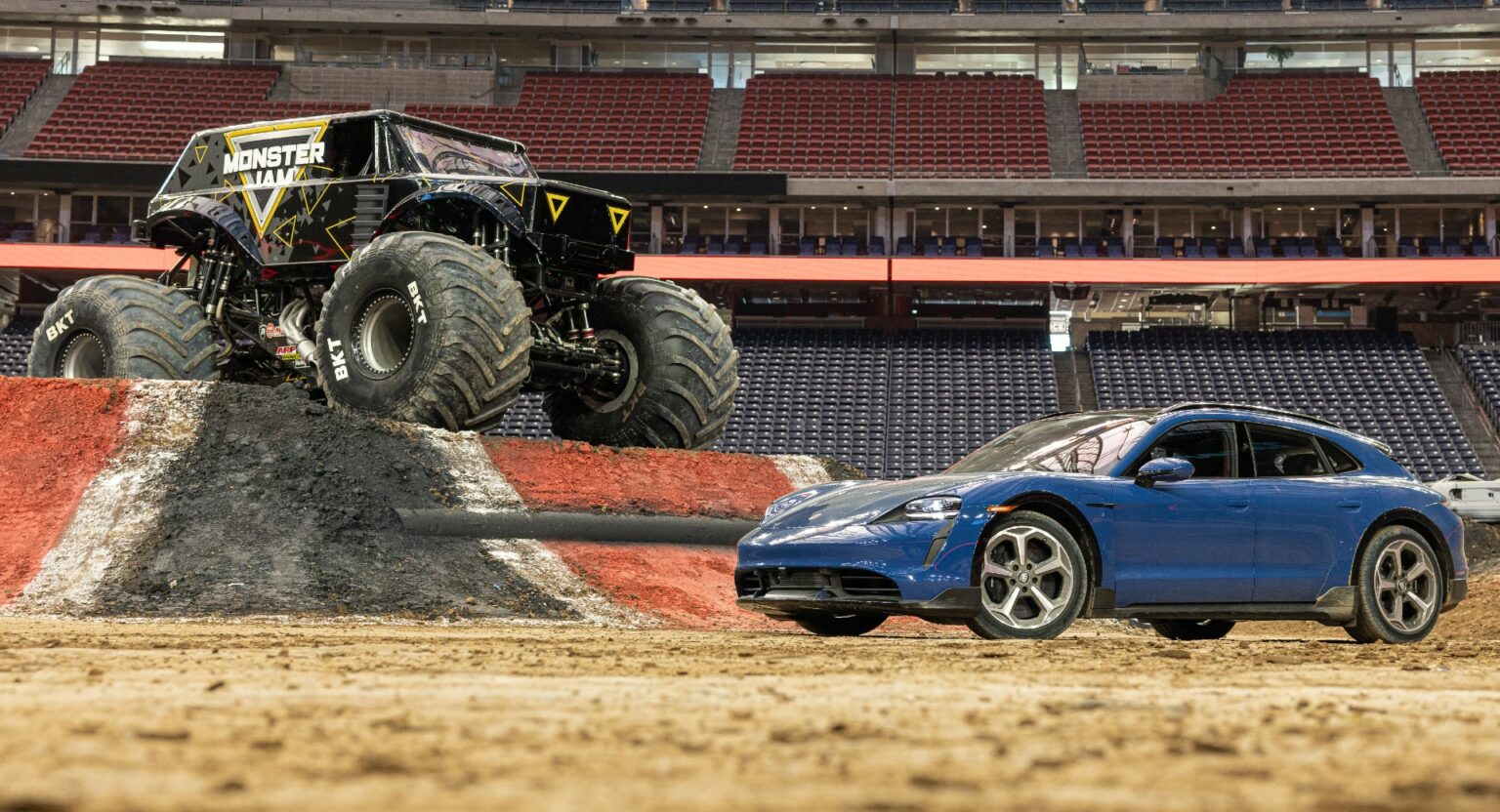 Watch A Monster Truck Flying Over A Porsche Taycan Cross Turismo ...