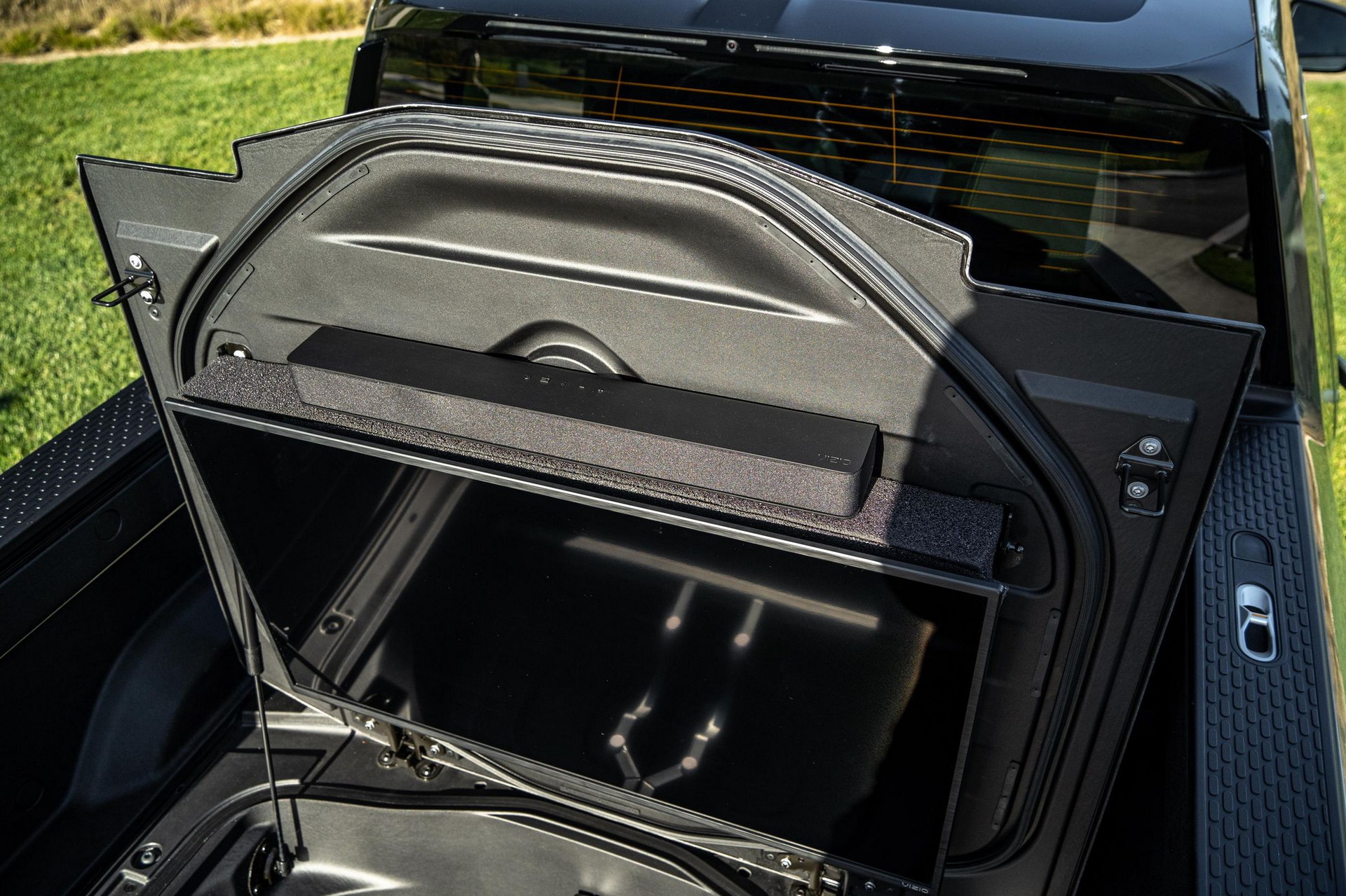 Rivian R1T With A Hidden Bed TV Is The Ultimate Tailgate Vehicle ...