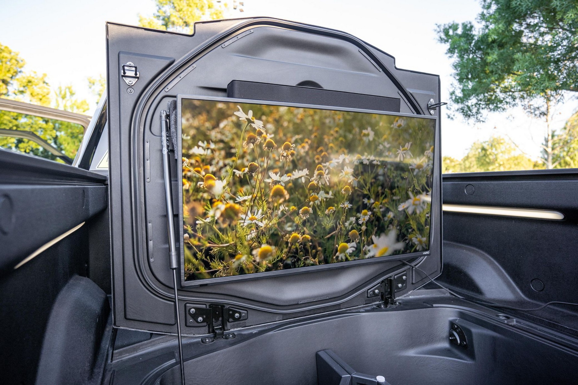 Rivian R1T With A Hidden Bed TV Is The Ultimate Tailgate Vehicle ...