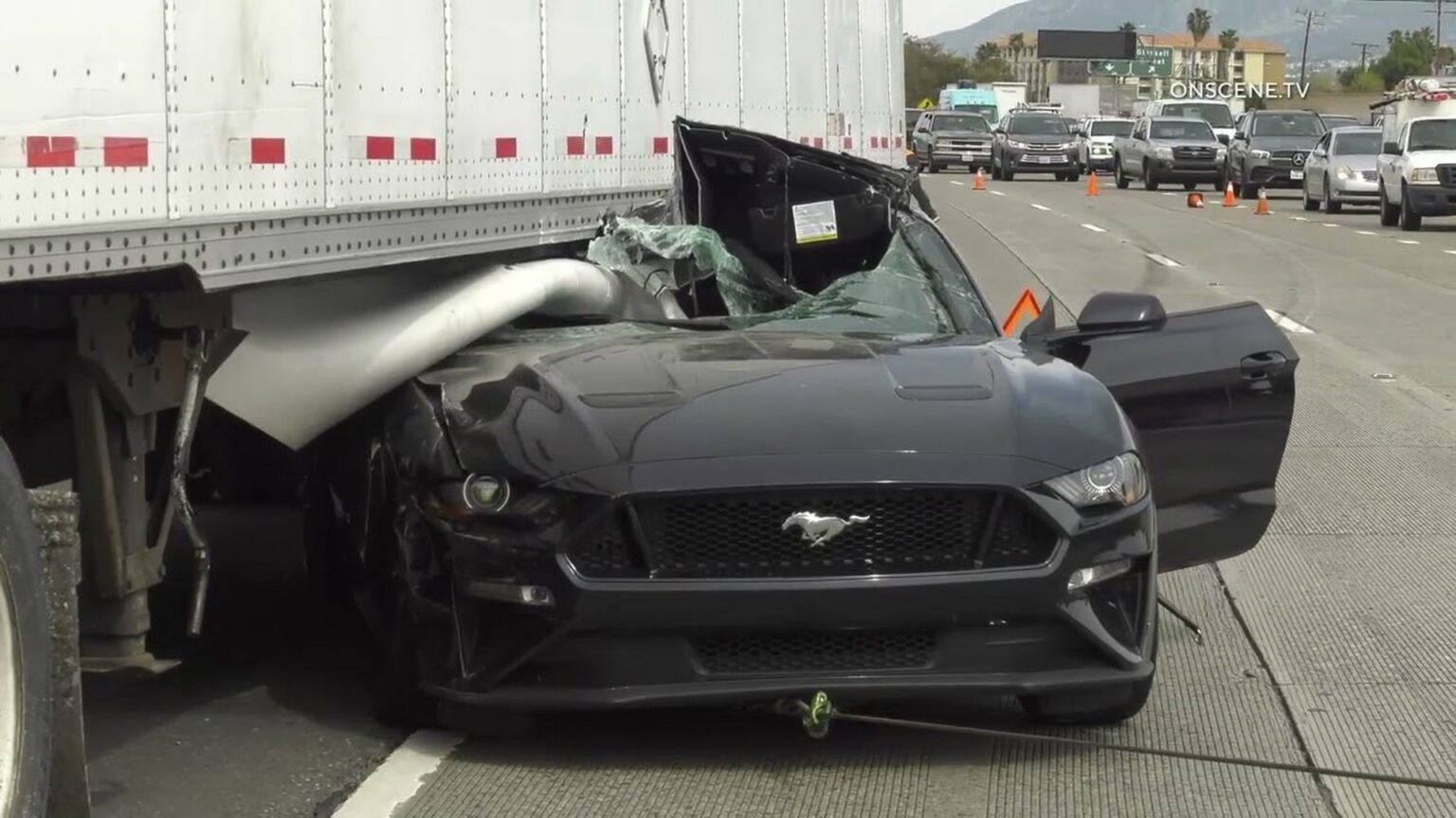Watch Workers Pull Out A Mustang Wedged Under Big Rig After Horrific ...