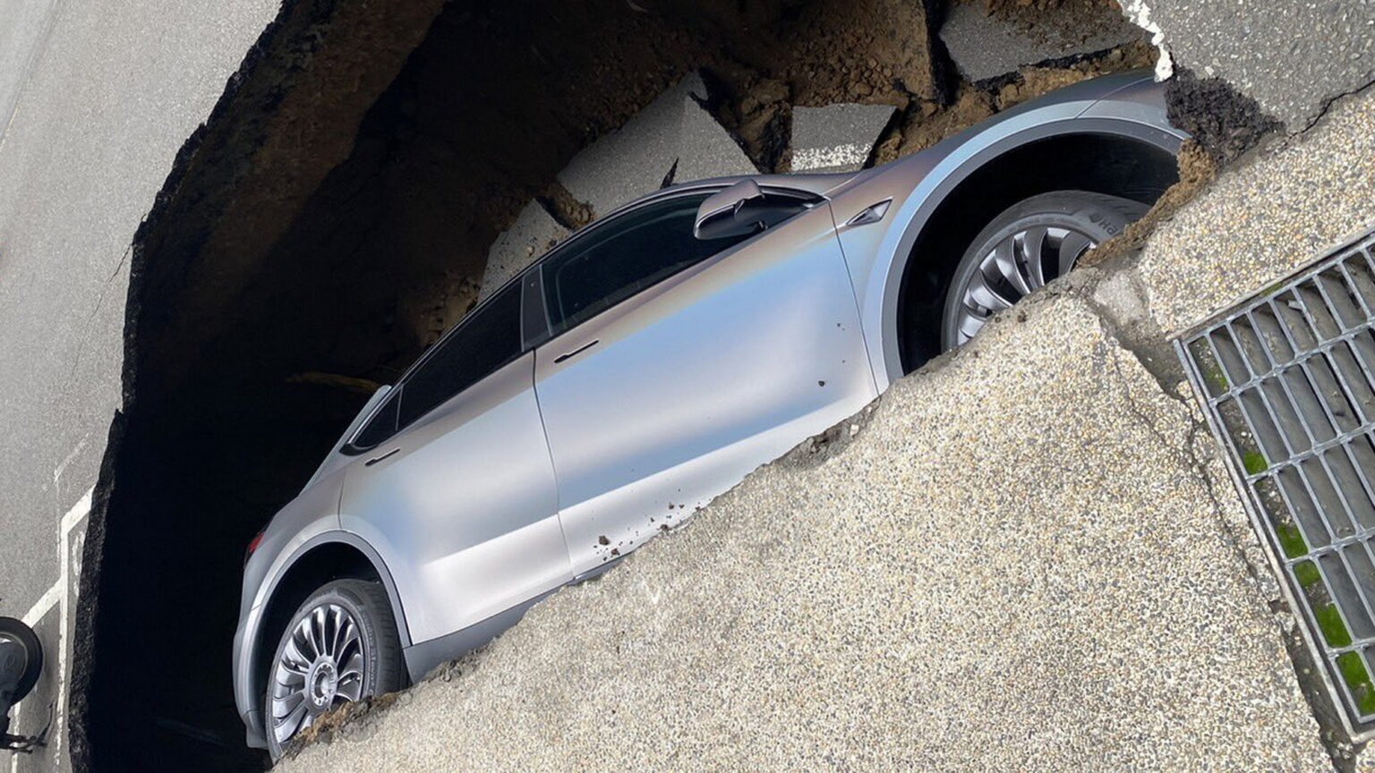 Sinkhole Suddenly Swallows Tesla Model Y Parked In Taiwan | Carscoops