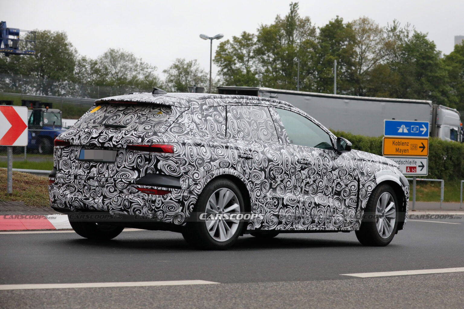 Audi Q6 E-tron Spied With More Agressive Bumper And Fender Vents, Is It ...