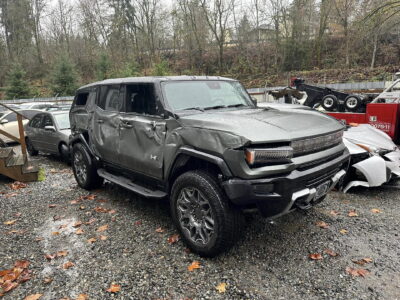 Ouch! Transporter Flips Over Knocking Down GMC Hummer EV And Mercedes ...