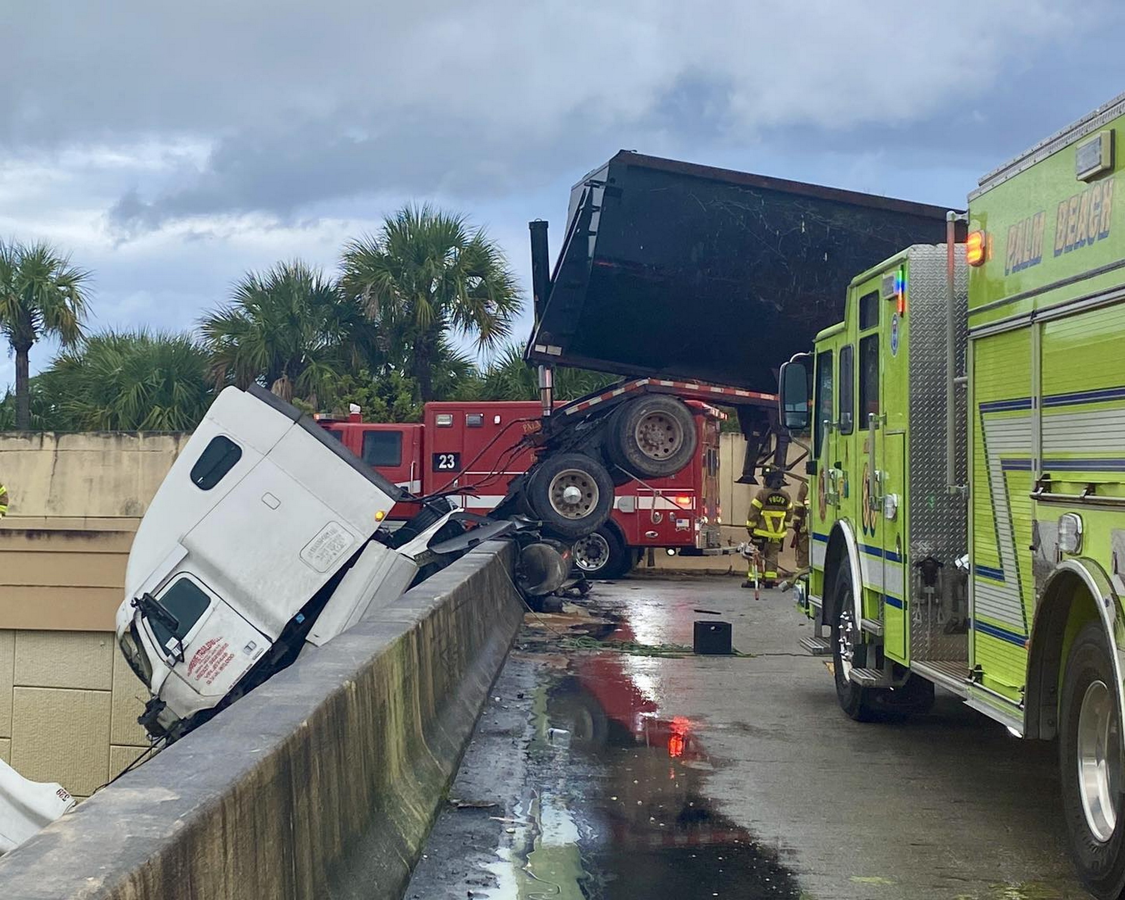 Watch Florida Firefighters Snatch Driver From 18-Wheeler Hanging Off ...