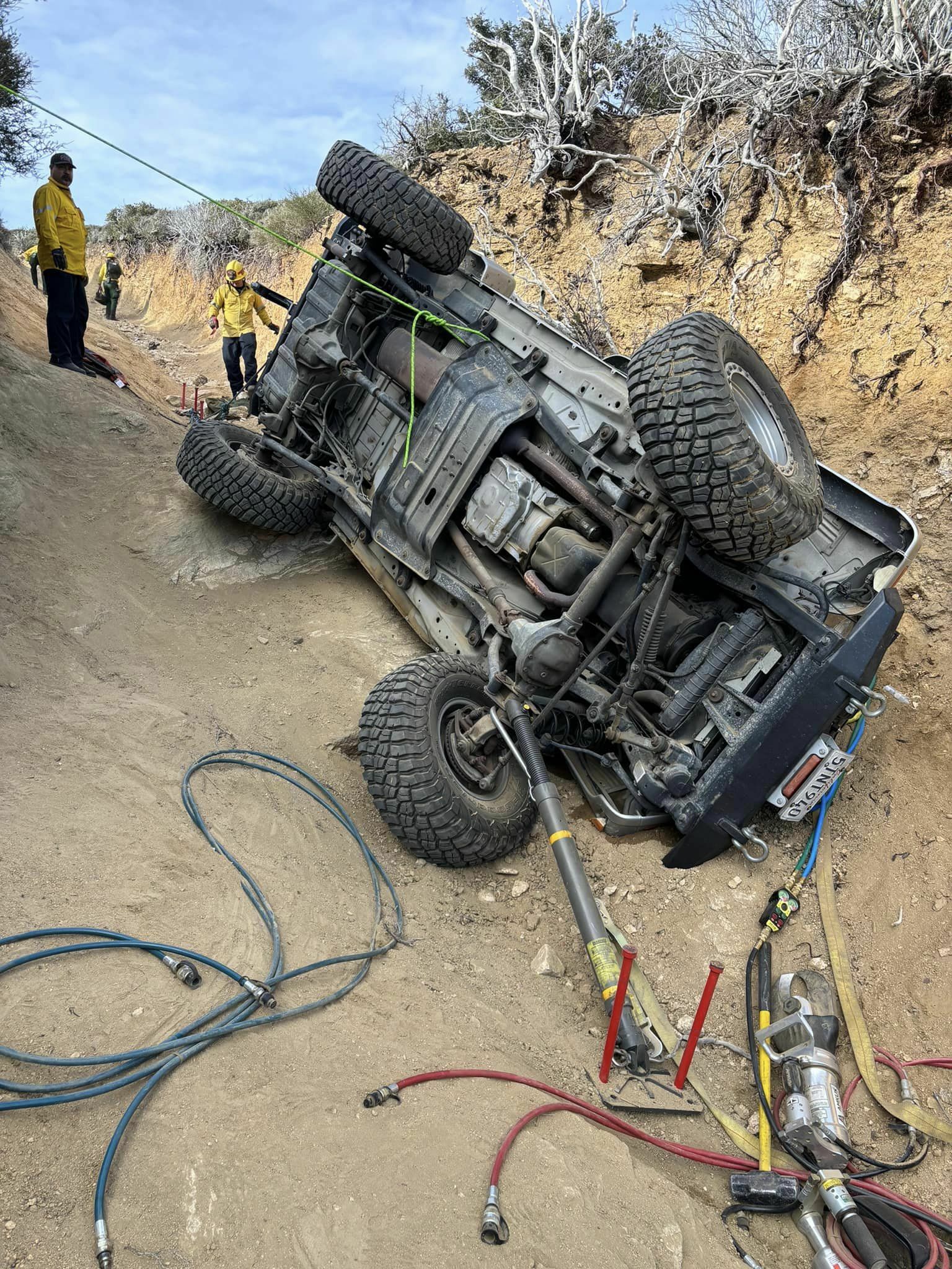 Jeep Takes A Tumble And Traps Driver On Remote Off-Road Trail Sparking ...