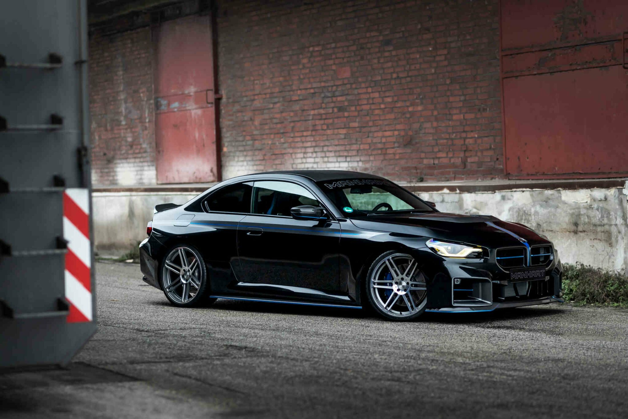 Manhart’s 552-HP BMW M2 Looks Sinister With Carbon Bits And 21-Inch ...