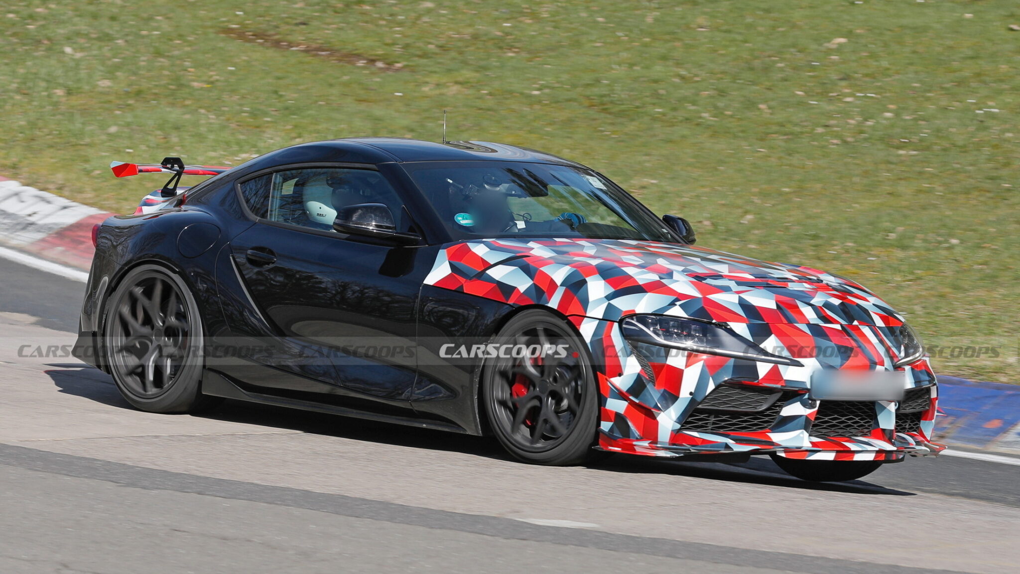 2025 Toyota Supra GRMN Spotted With New Hood, Upgraded Wing | Carscoops