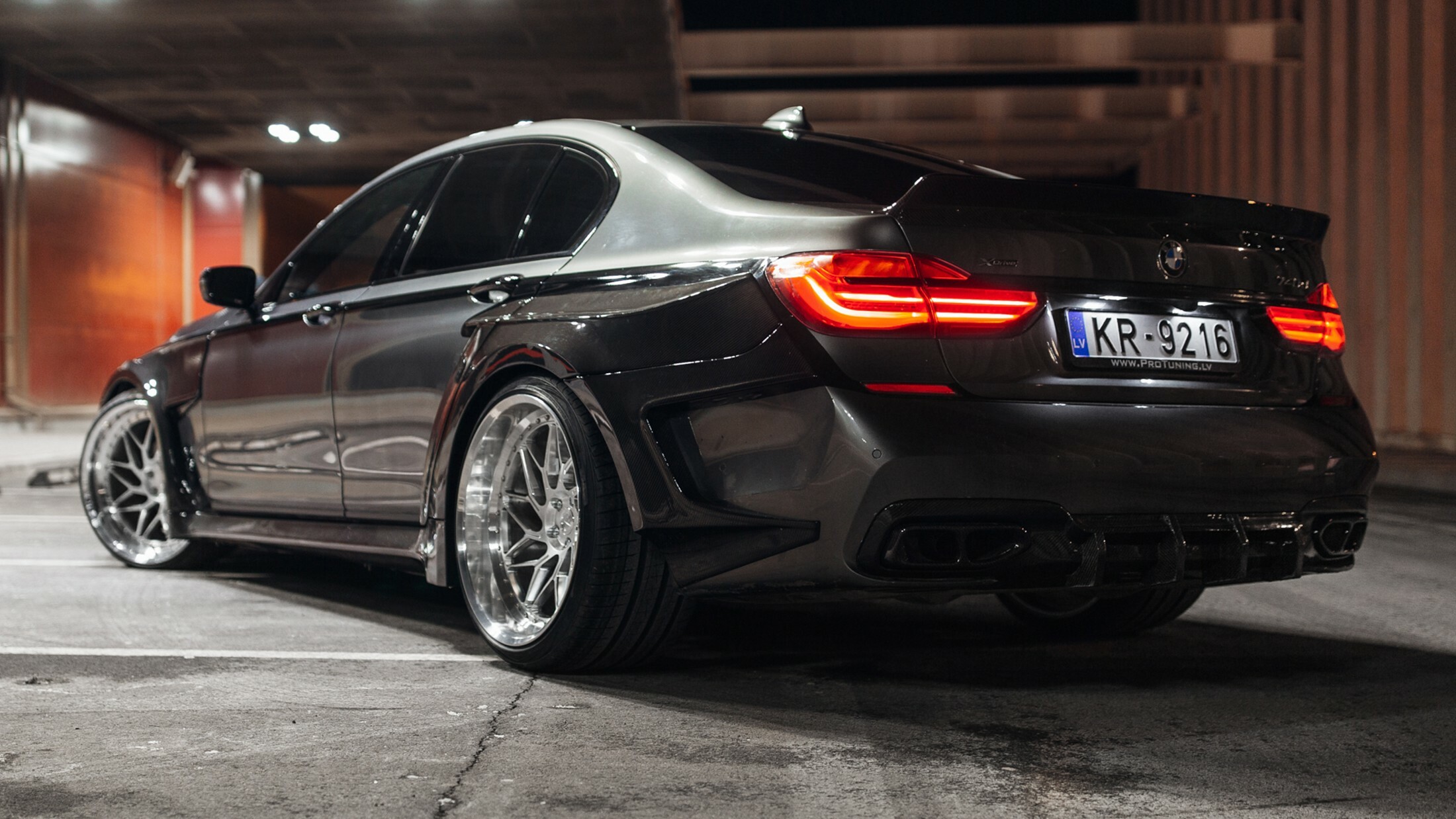 BMW G11 7-Series Tries On A Carbon Fiber WideBody Kit And 22-Inch Wheels | Carscoops