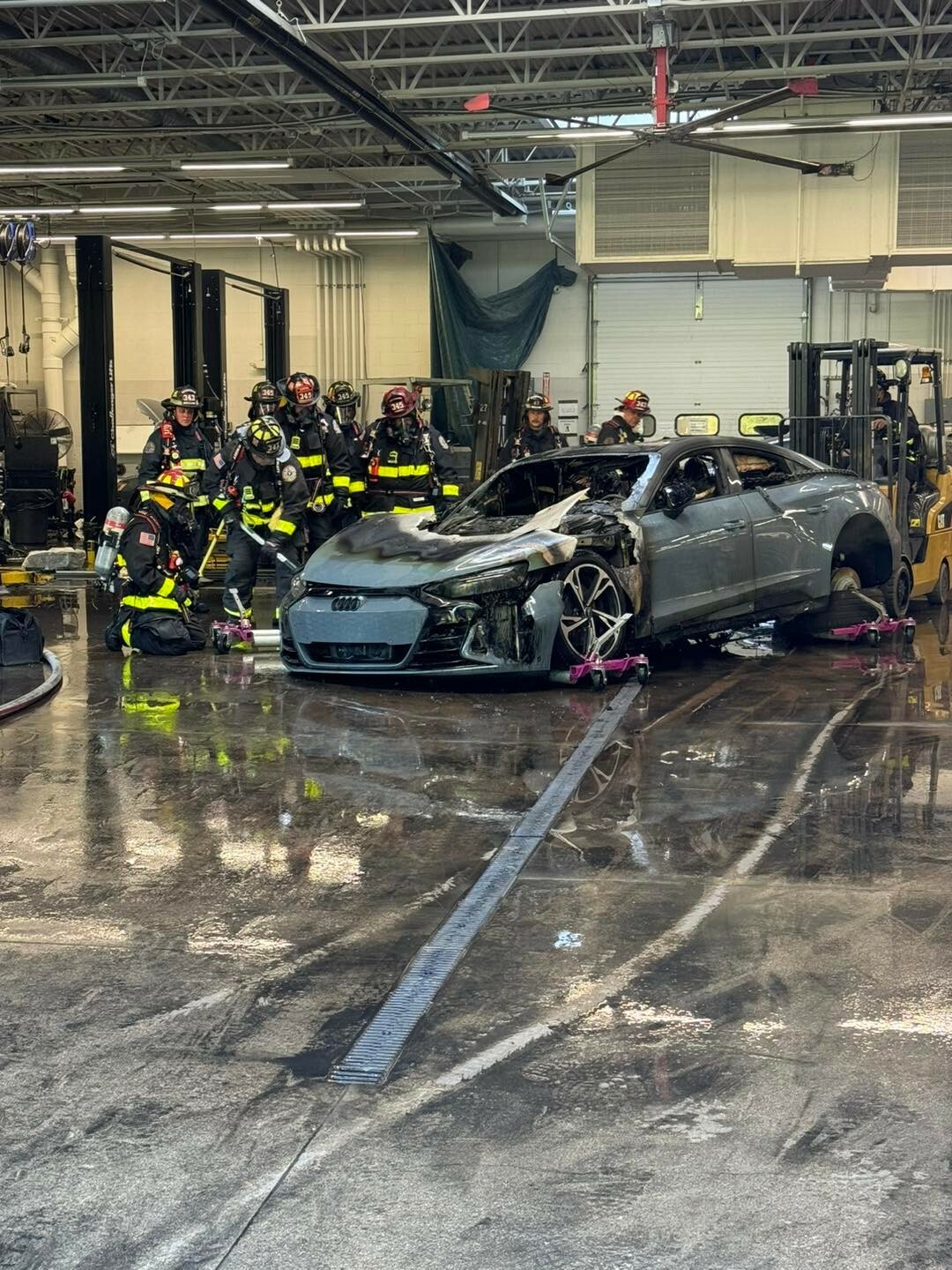Audi E-Tron GT Bursts Into Flames Inside Dealership | Carscoops