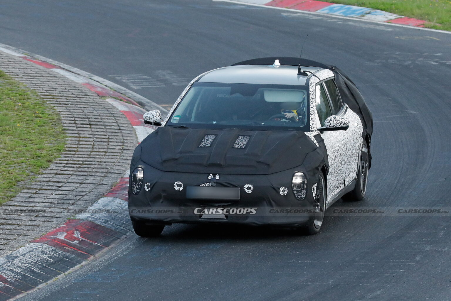 Kia EV4 Hatch Drops More Camo As It Hunts The MG4 | Carscoops