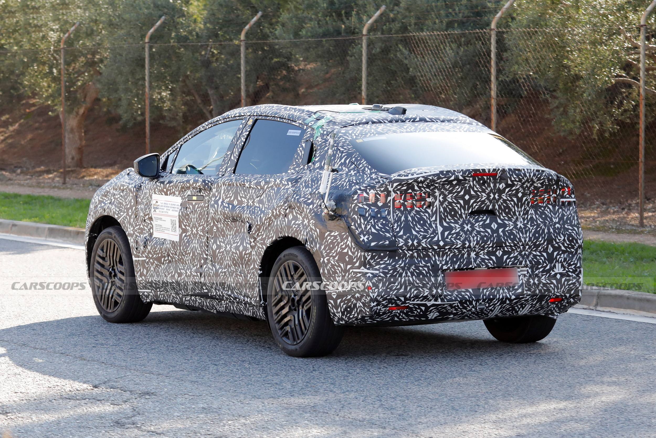 2026 Nissan Leaf Spied With Mini-Ariya SUV Coupe Looks | Carscoops