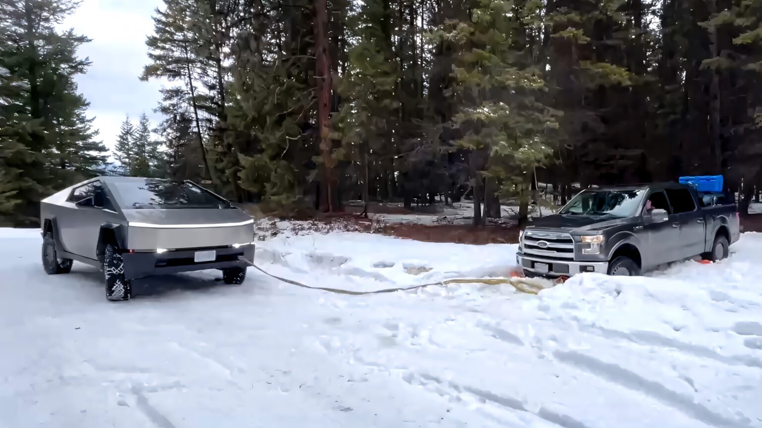 Real Or Staged? Tesla Cybertruck Yanks Stuck Ford F-150 From Snow ...