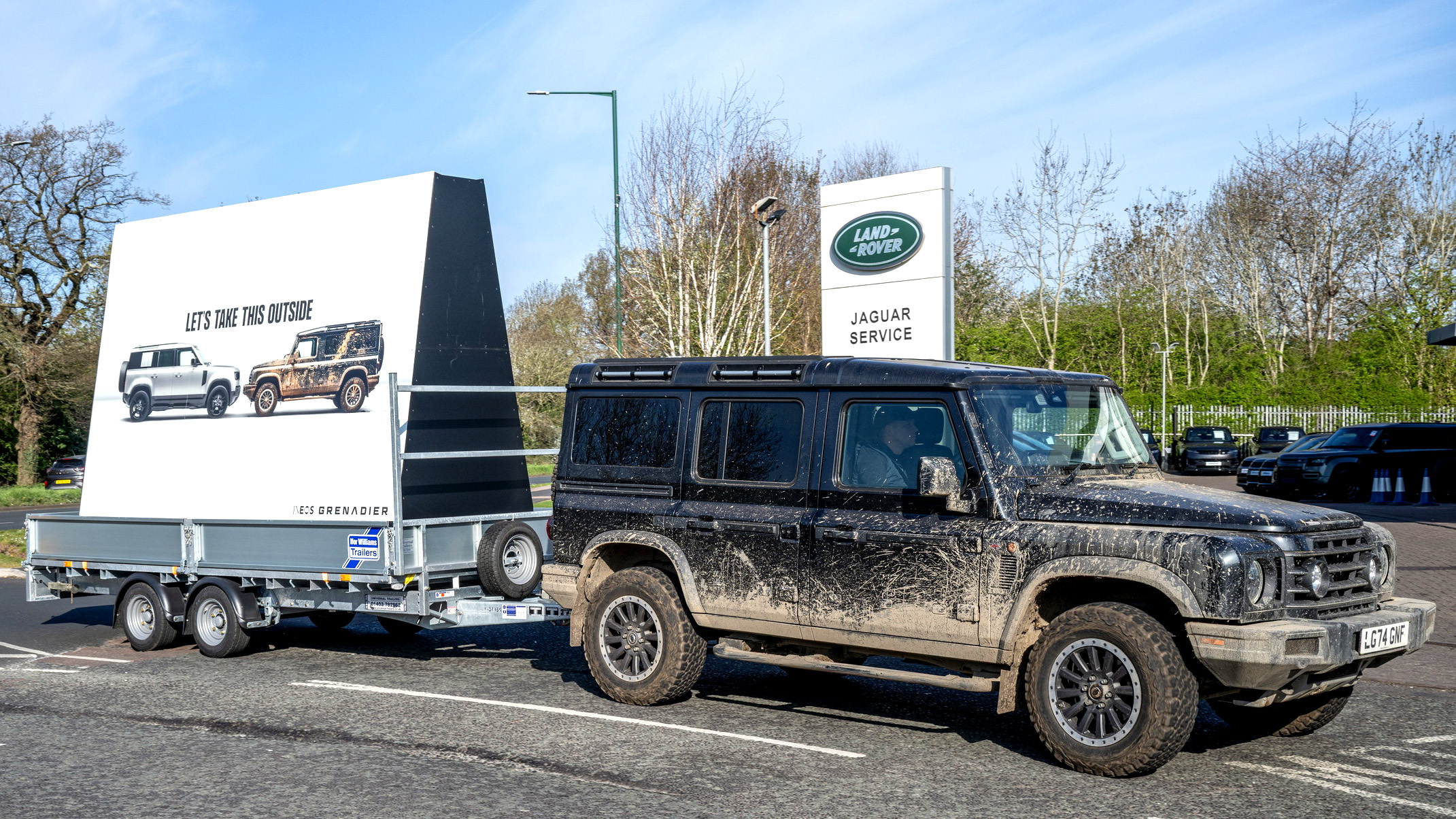 Land Rover Trolled In Public By A Muddy SUV And A Rolling Billboard ...