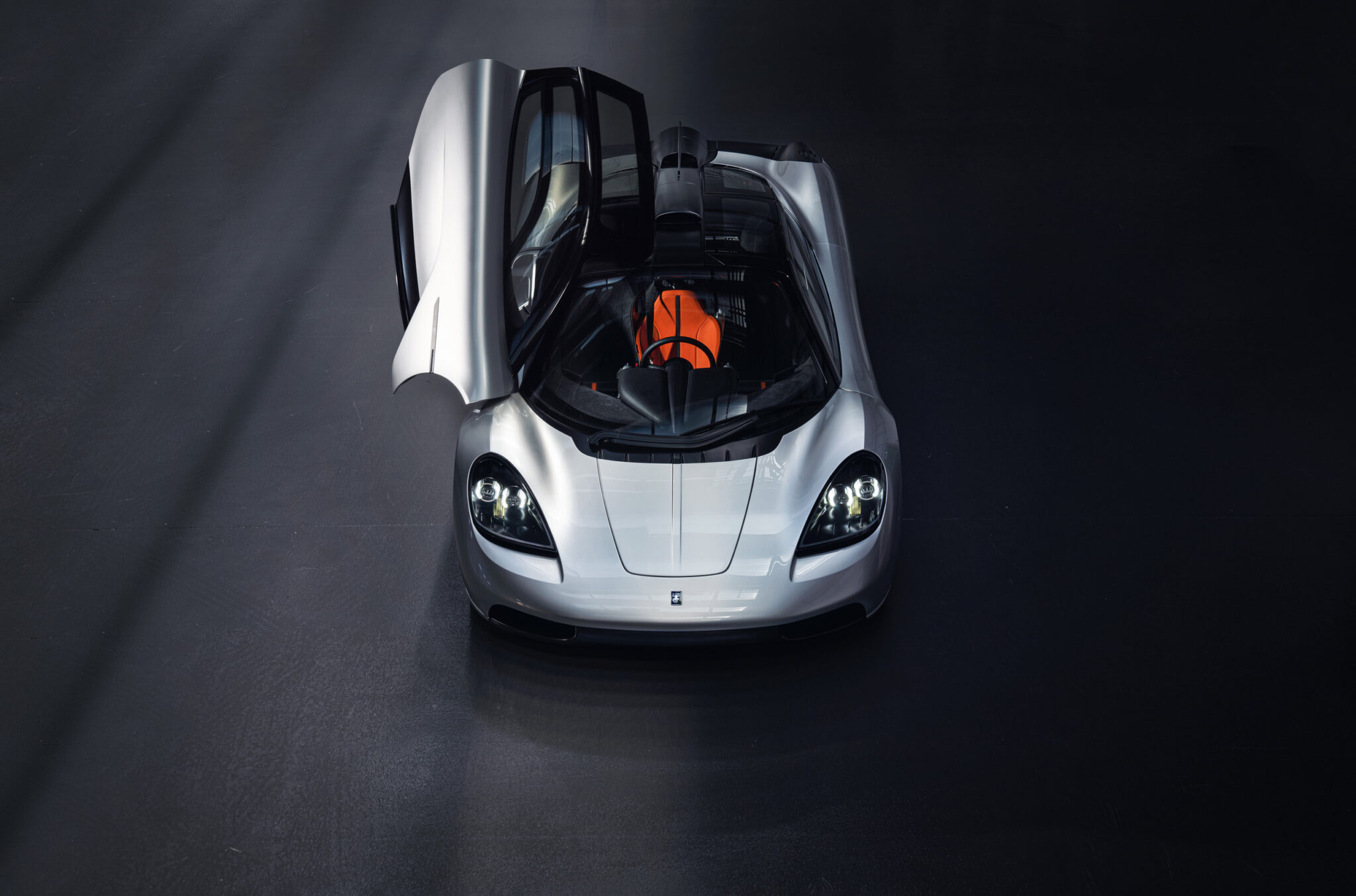 This V12 Supercar Gets 30 MPG And Still Clears Speed Bumps Like A Civic ...