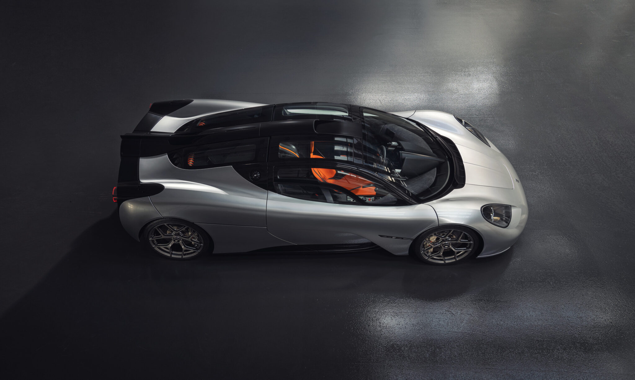 This V12 Supercar Gets 30 MPG And Still Clears Speed Bumps Like A Civic ...