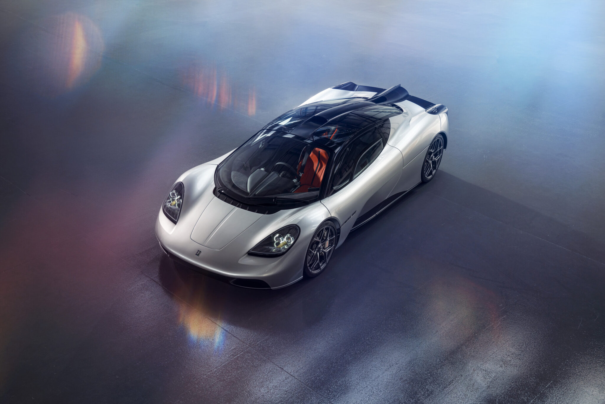 This V12 Supercar Gets 30 MPG And Still Clears Speed Bumps Like A Civic ...
