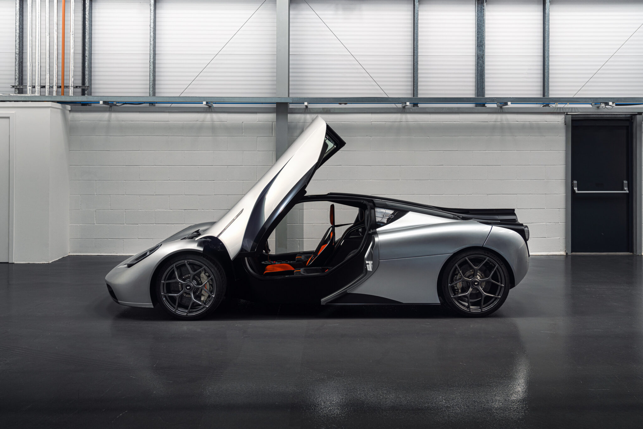 This V12 Supercar Gets 30 MPG And Still Clears Speed Bumps Like A Civic ...