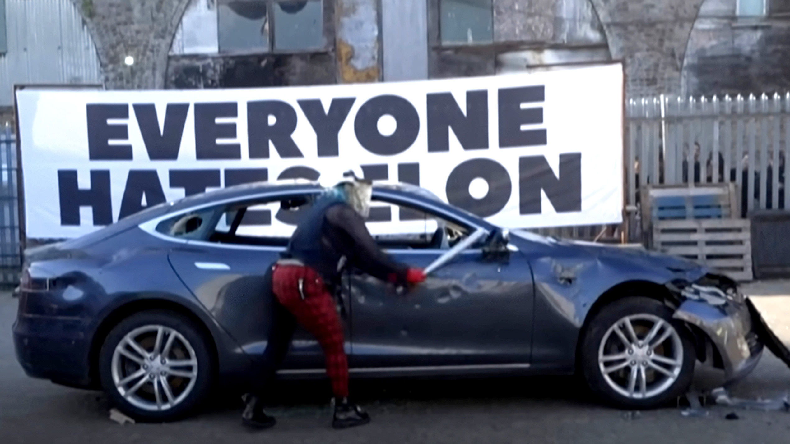 Furious Protesters Smash A Tesla To Pieces In ‘Everyone Hates Elon ...