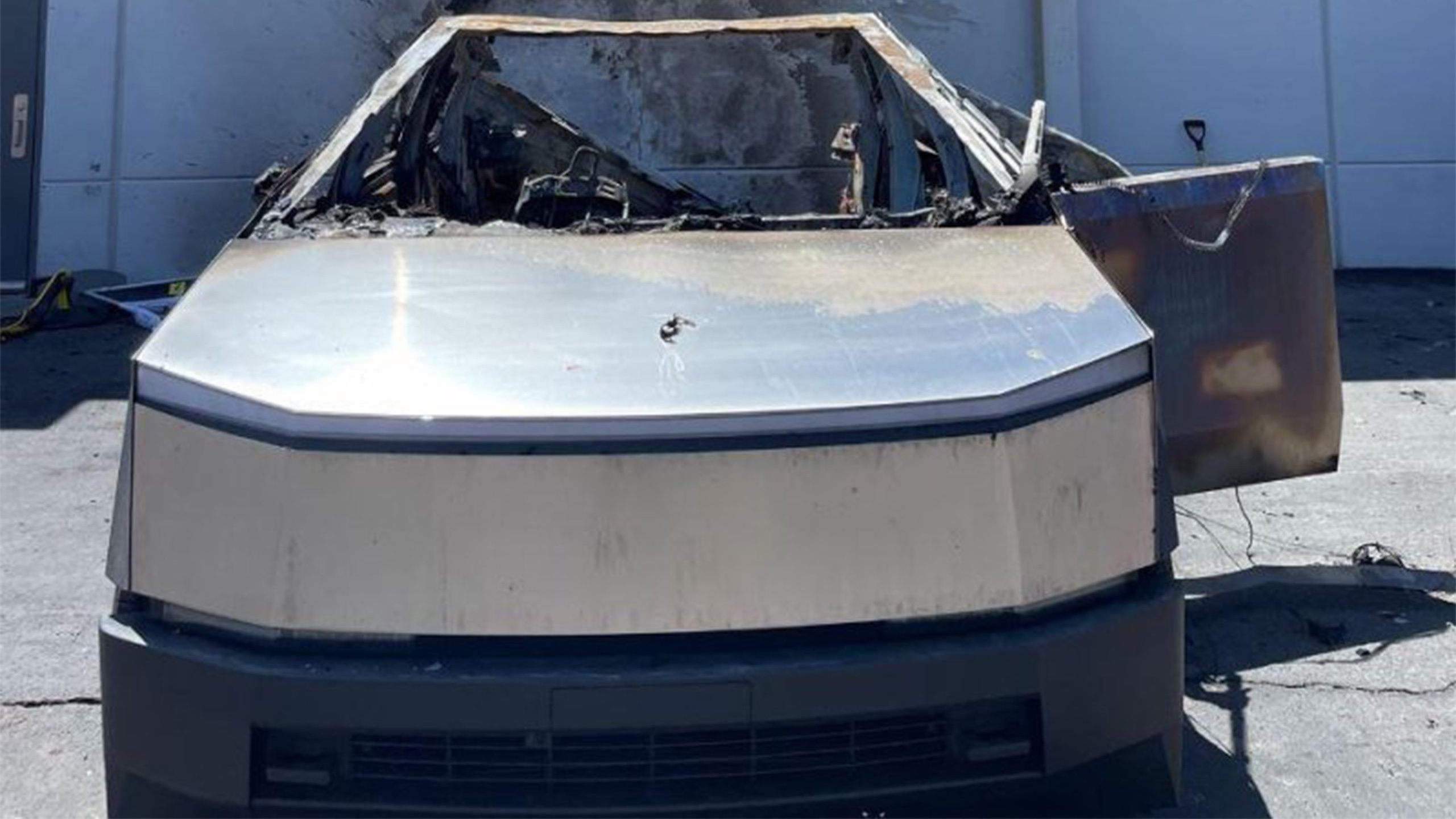 Masked Man Allegedly Caught With Tesla Map After Torching Cybertruck ...